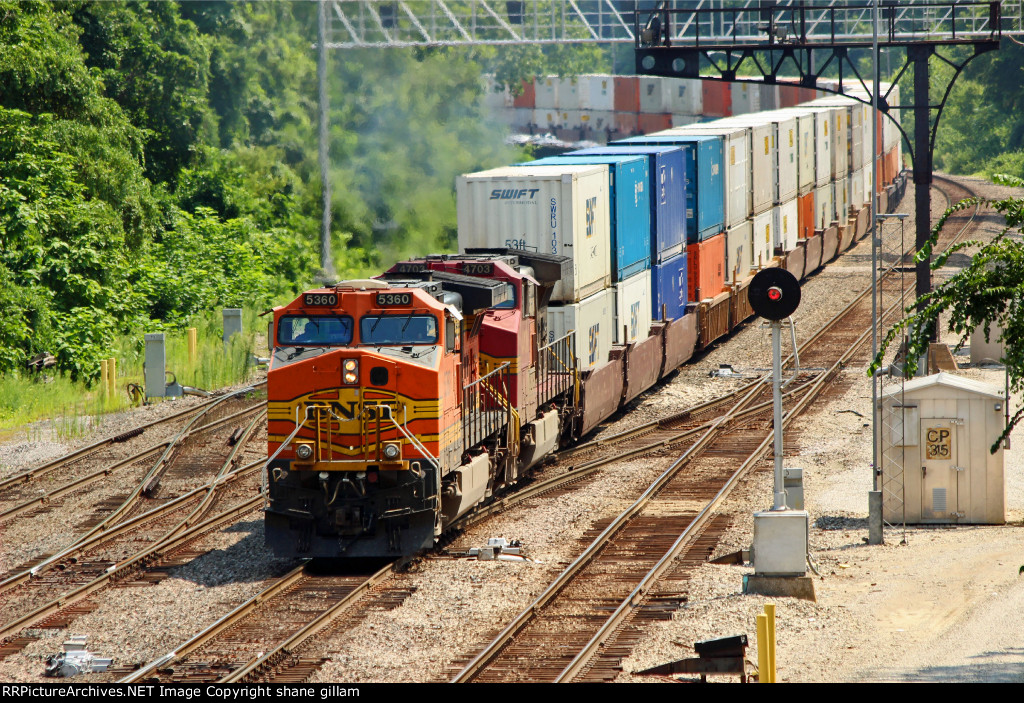 BNSF 5360 Wb stack train gets under way.